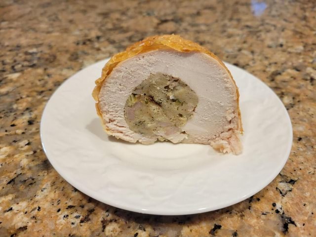 Deboned a turkey breast and fattened it out the best we could. Filled ...