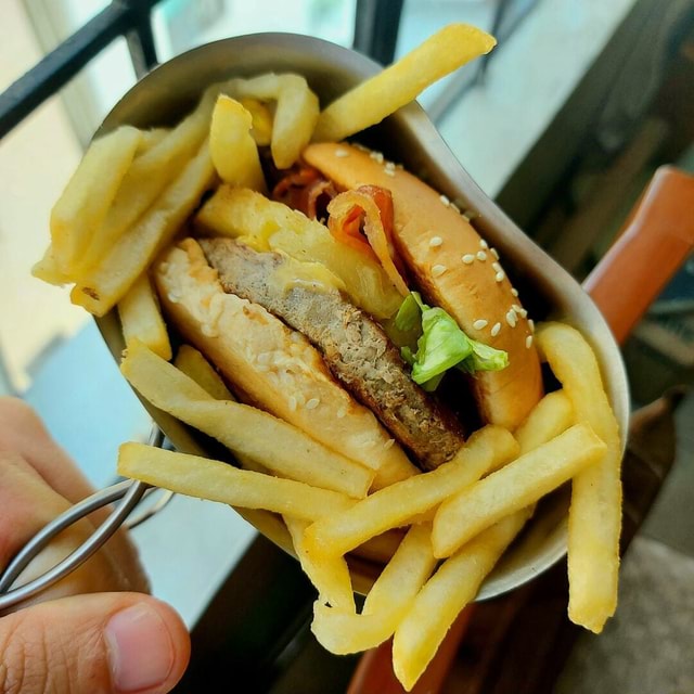 Jollibee Amazing Aloha Champ burger with fries in my canteen cup - iFunny