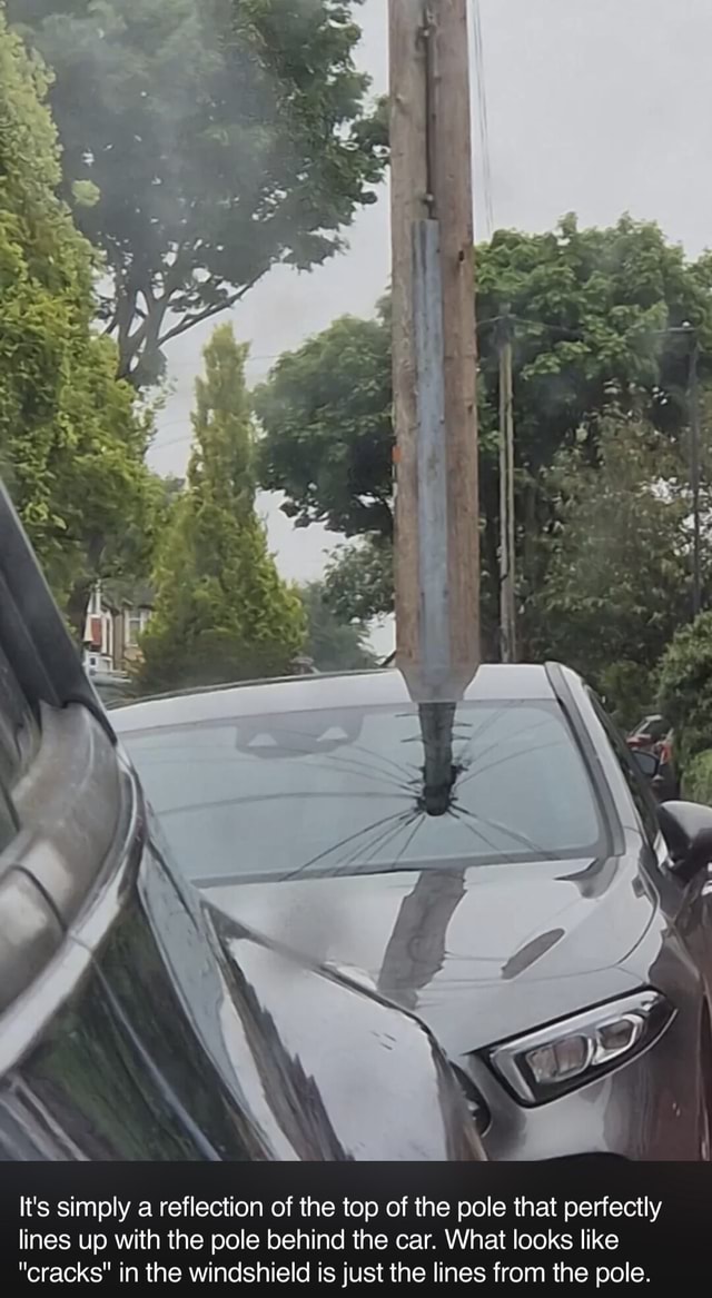 It's simply a reflection of the top of the pole that perfectly lines up ...