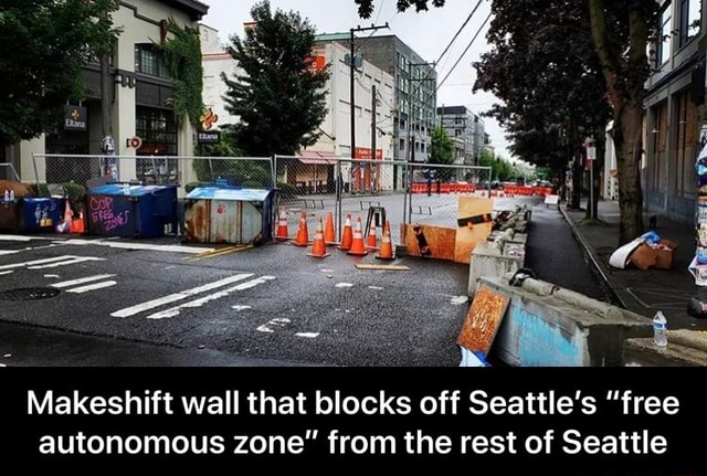 E h Las Makeshift wall that blocks off Seattle's "free autonomous zone ...