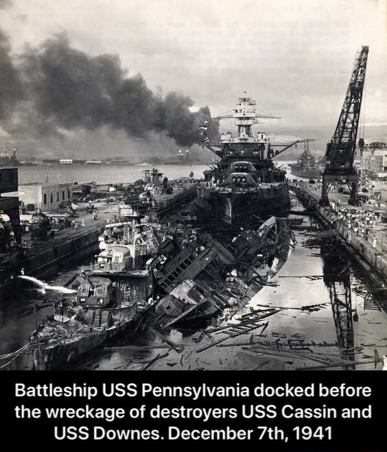 Battleship USS Pennsylvania docked before the wreckage of destroyers ...