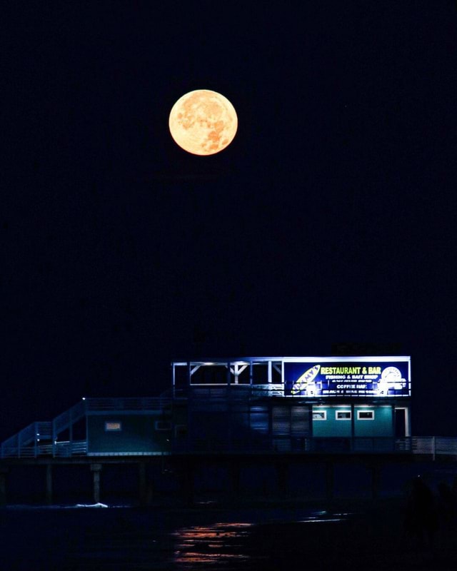 Full moon setting over the Galveston Island this morning Captured by ...
