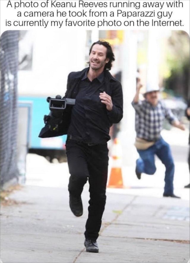 A photo of Keanu Reeves running away with a camera he took from a ...