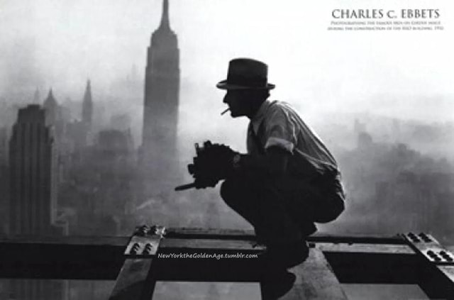 Smoking while crouched on a beam of the RKO Building, still under ...