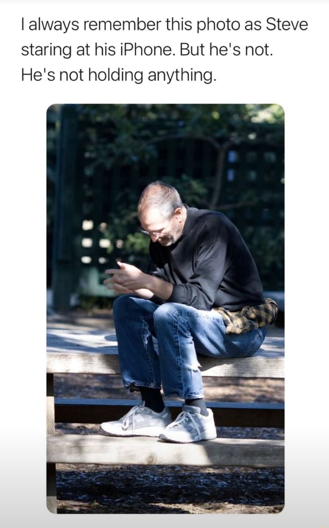I always remember this photo as Steve staring at his iPhone. But he's ...