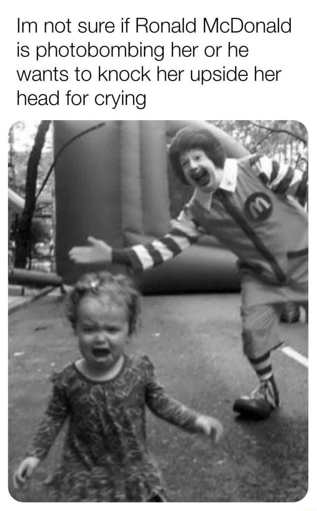 Im not sure if Ronald McDonald is photobombing her or he wants to knock ...