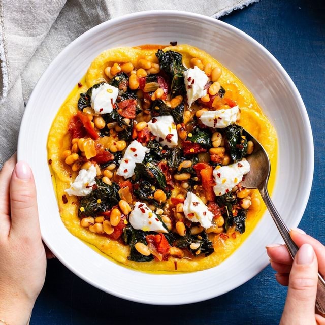 Polenta makes the perfect base for a stewy mixture of kale tomatoes and ...