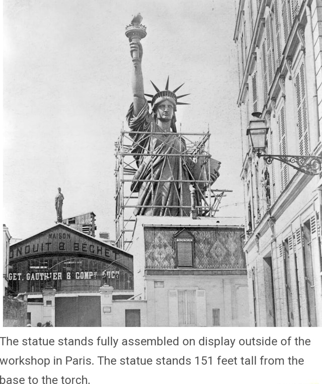 Ss Ss SSs SS 14 COMPY The statue stands fully assembled on display ...