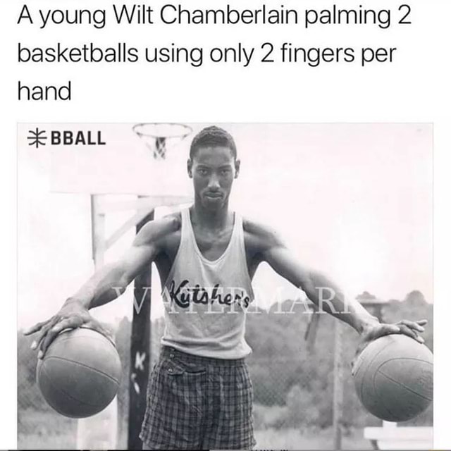 A young Wilt Chamberlain palming 2 basketballs using only 2 fingers per ...