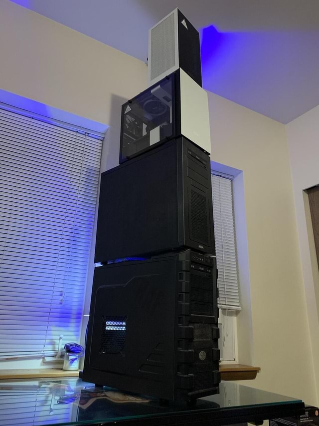 Here is a tower of computers that represents a decade of upgrades. - iFunny