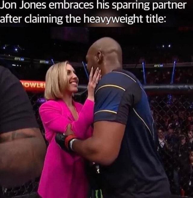 Jon Jones embraces his sparring partner after claiming the heavyweight ...