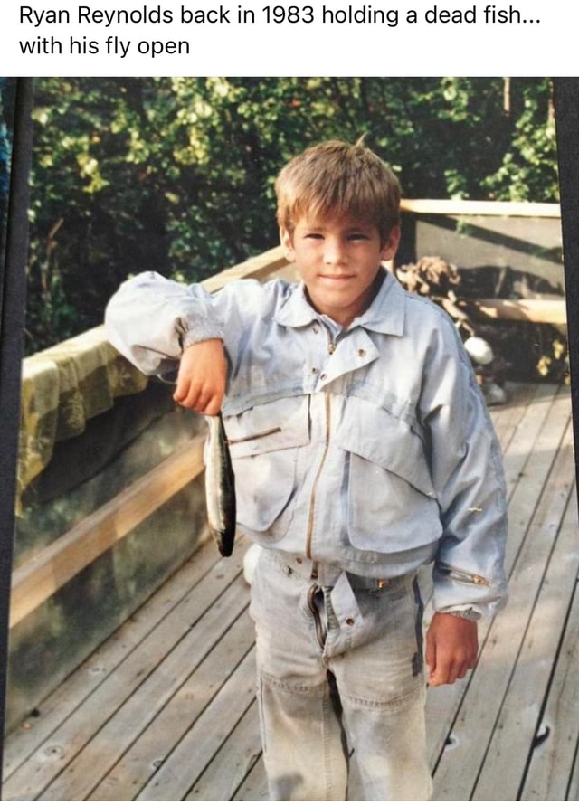 Ryan Reynolds back in 1983 holding a dead fish... with his fly open AS ...