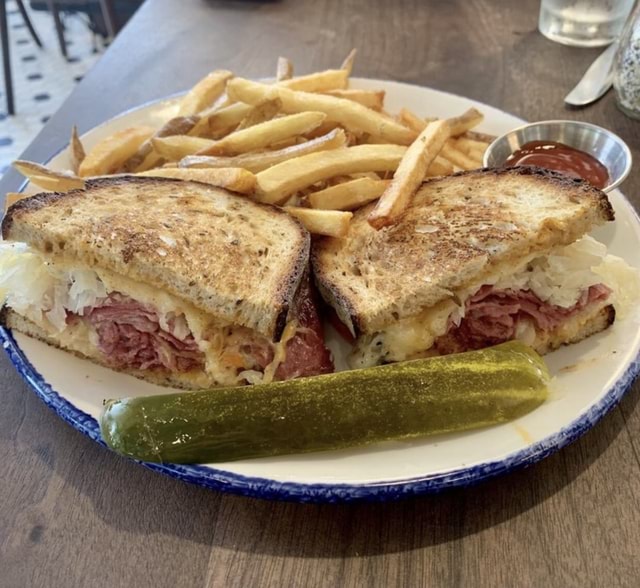 Corned beef (6 oz), sauerkraut, melted Swiss cheese, Russian dressing ...