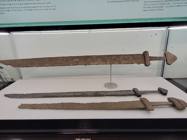 Jouble-edged, but single-edged swords were also used, forging together ...