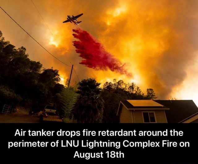 Air tanker drops fire retardant around the perimeter of LNU Lightning ...