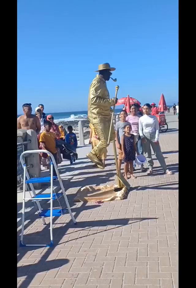 Street performer appears to be floating in the air ...