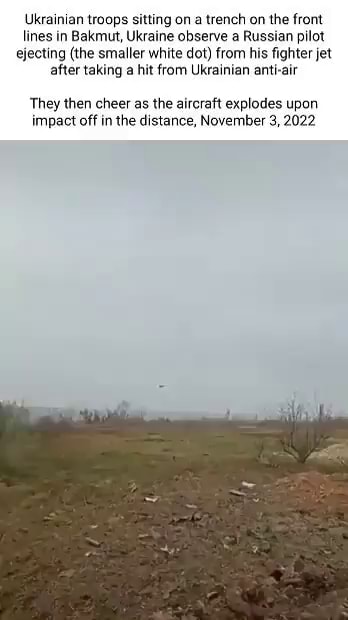 Ukrainian troops sitting on a trench on the front lines in Bakmut ...